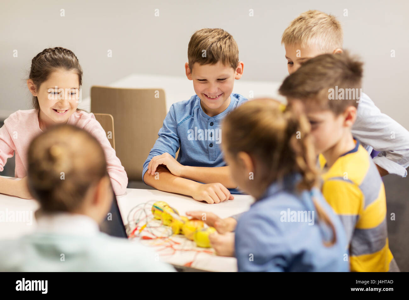 happy children building robots at robotics school Stock Photo - Alamy