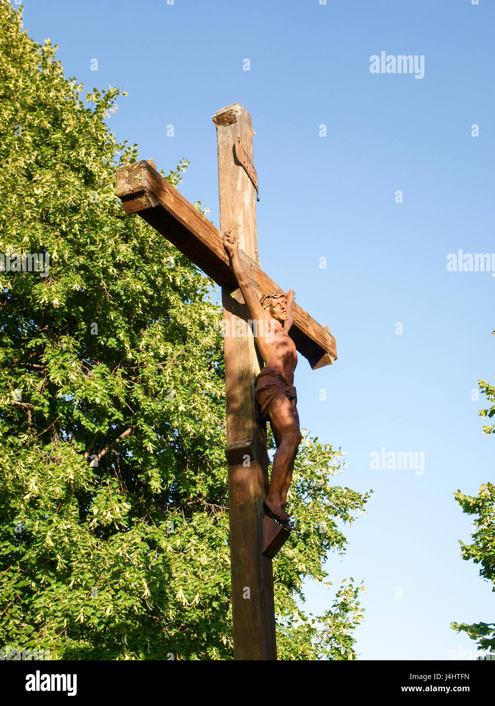 France: Cross with Christ in the public park Stock Photo - Alamy