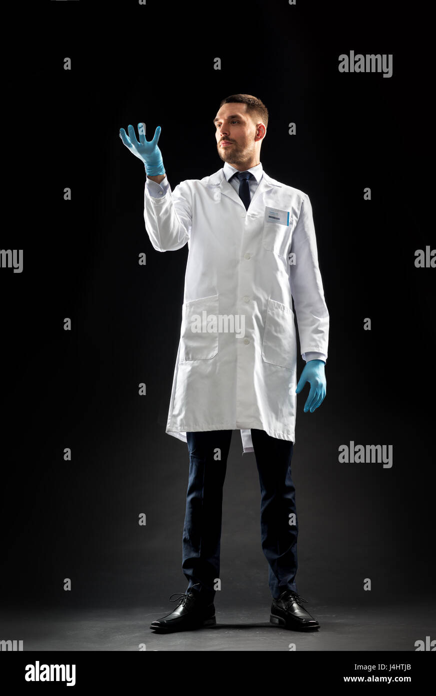 doctor or scientist in lab coat and medical gloves Stock Photo - Alamy