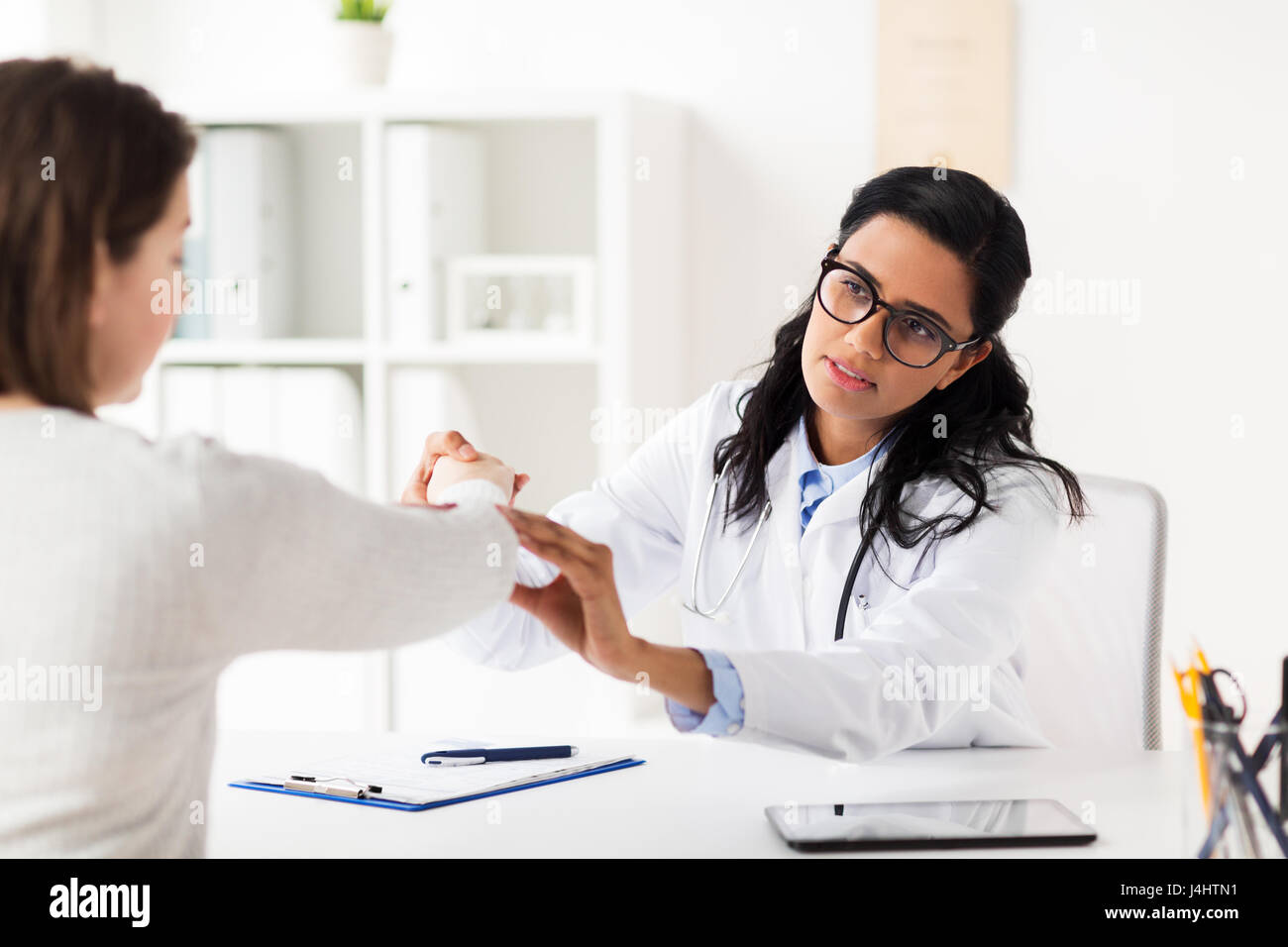 doctor examining patient hand at hospital Stock Photo - Alamy