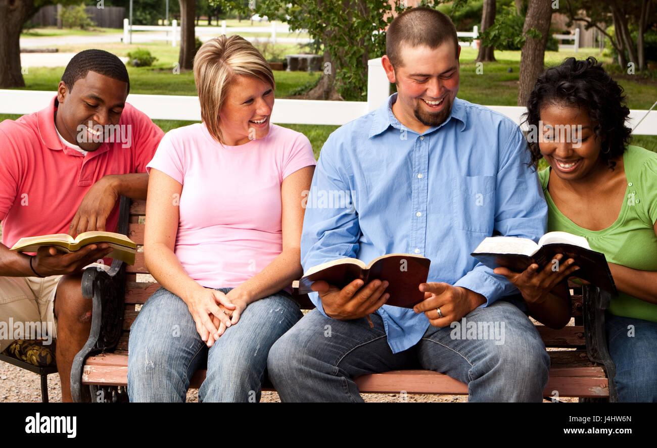 Small group of people talking and reading the Bible Stock Photo - Alamy