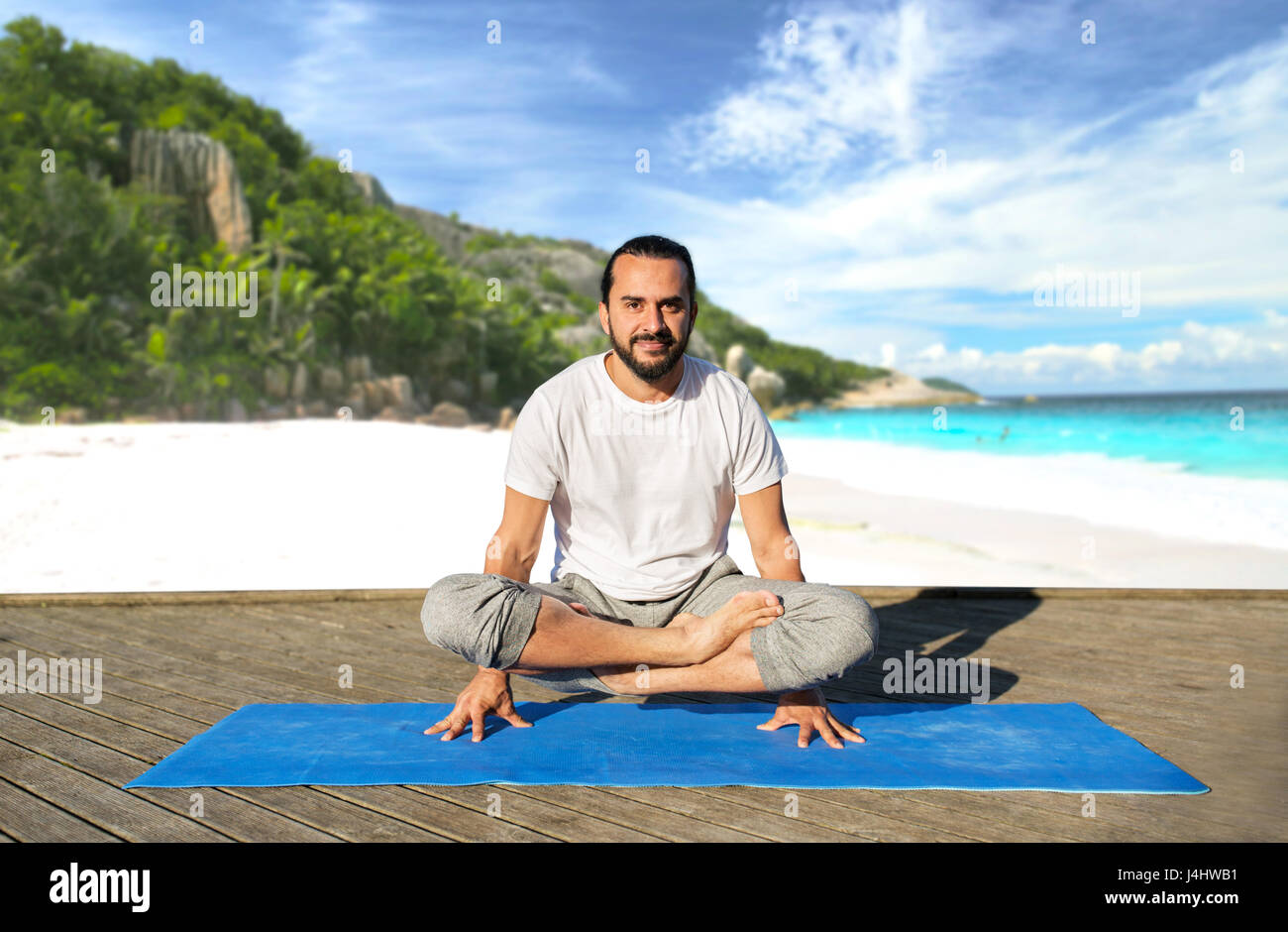 man making yoga in scale pose outdoors Stock Photo - Alamy