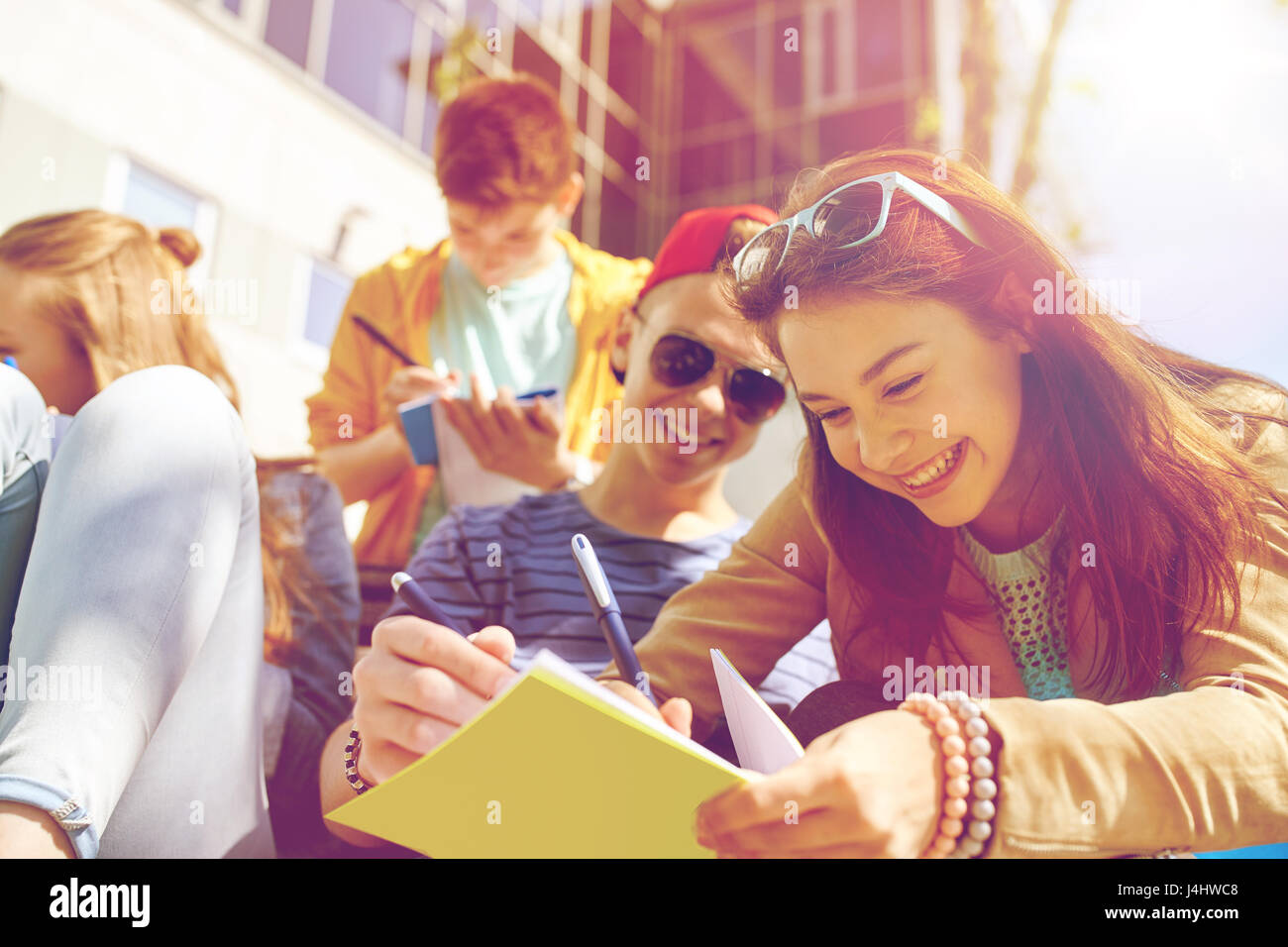 group of students with notebooks at school yard Stock Photo - Alamy