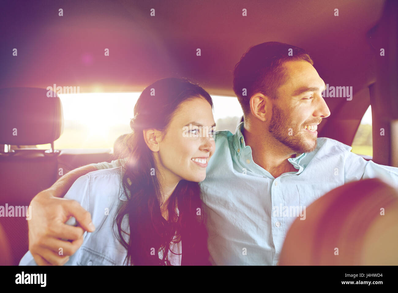 Couple hugging in back seat hi-res stock photography and images - Alamy