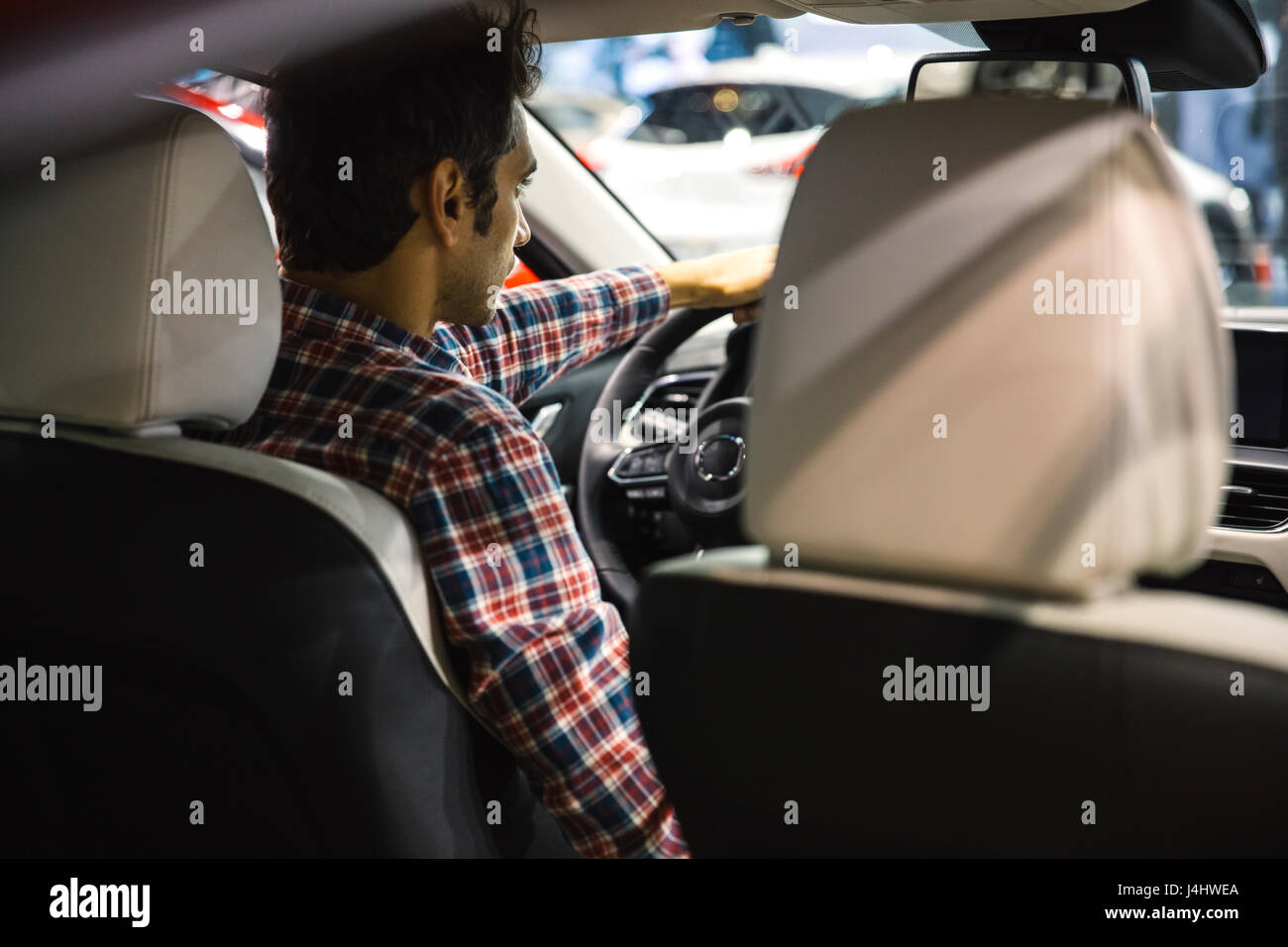 Handsome young man driving a modern car Stock Photo - Alamy