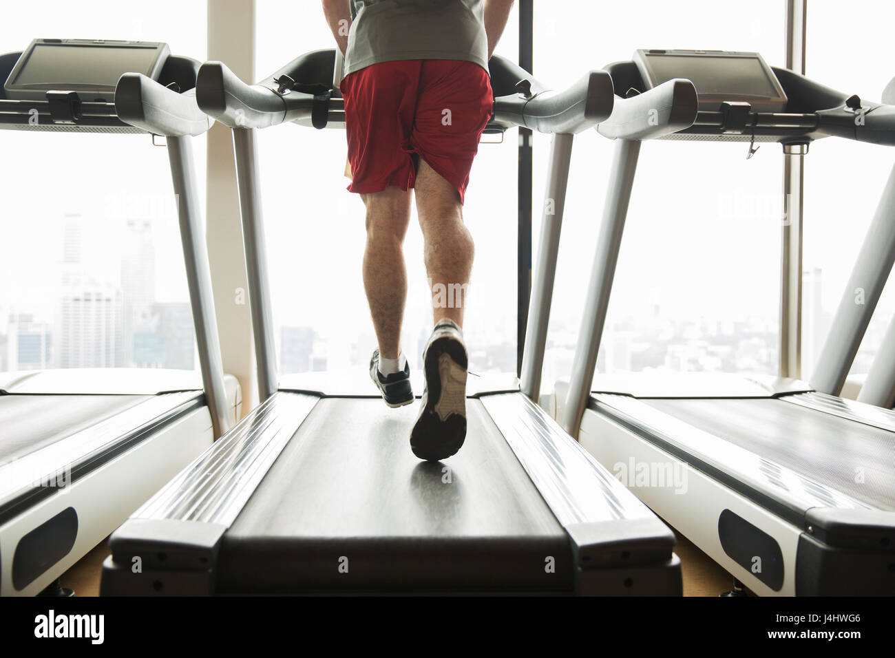 man exercising on treadmill in gym Stock Photo - Alamy