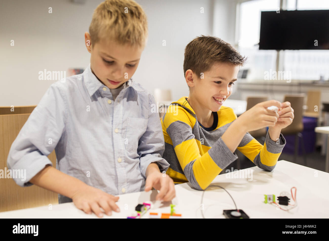 happy children building robots at robotics school Stock Photo - Alamy