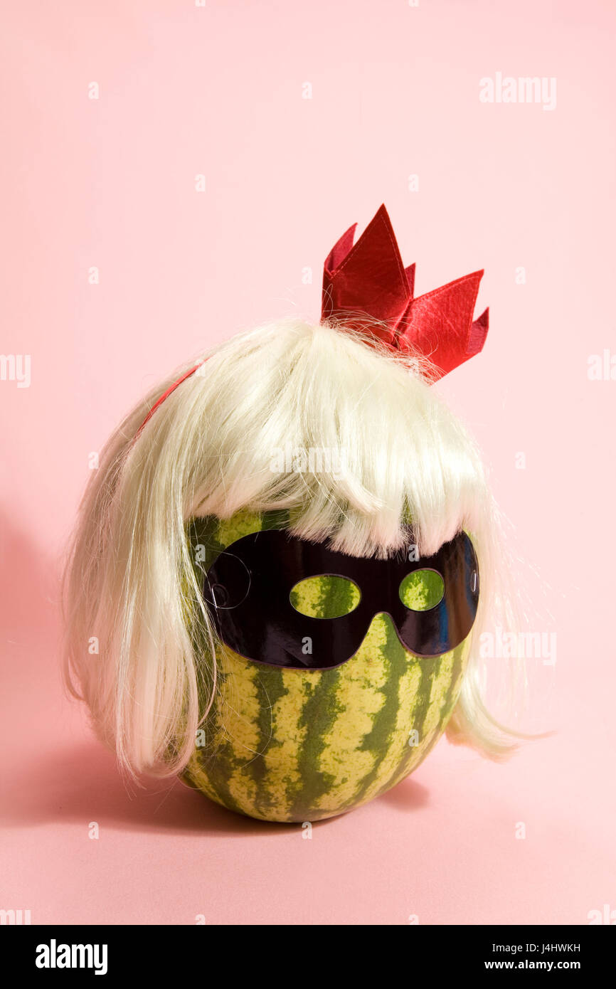 Superwatermelon wearing a black mask on a pink background Stock Photo ...