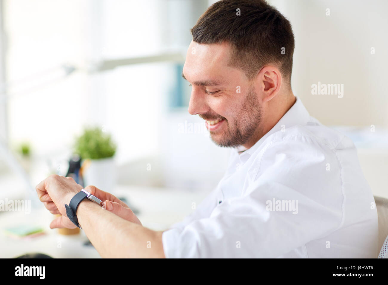 close up of businessman with smartwatch at office Stock Photo - Alamy