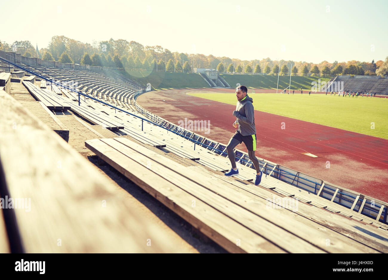 Happy young man running upstairs hi-res stock photography and images ...