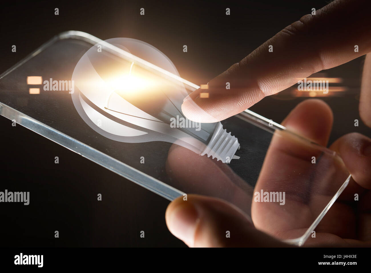 hands with smartphone and lightbulb projection Stock Photo - Alamy