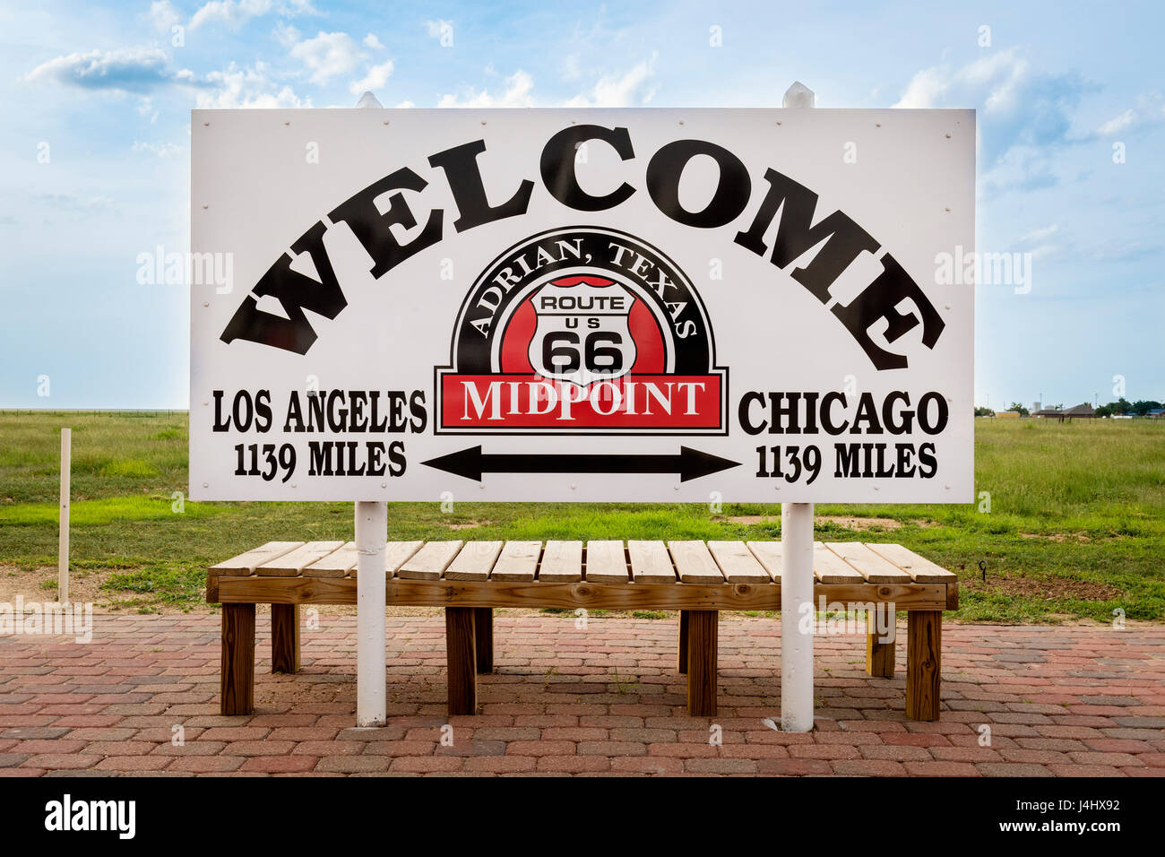 Adrian, Texas - July 9, 2014: Welcome sign marking the midpoint between ...