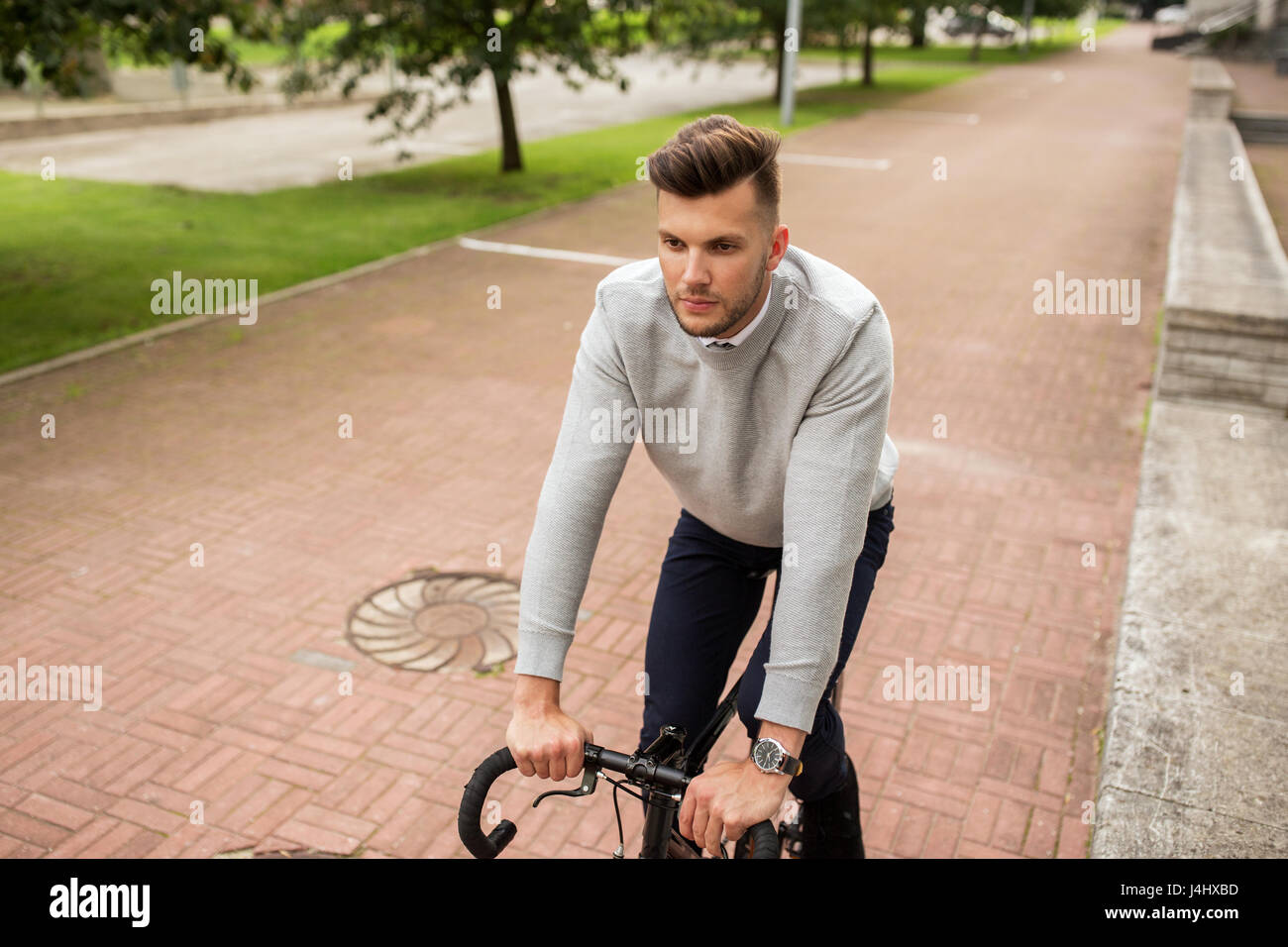 Guy riding bicycle hi-res stock photography and images - Alamy