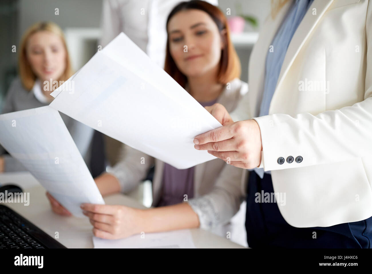 businesswomen with papers in office Stock Photo - Alamy