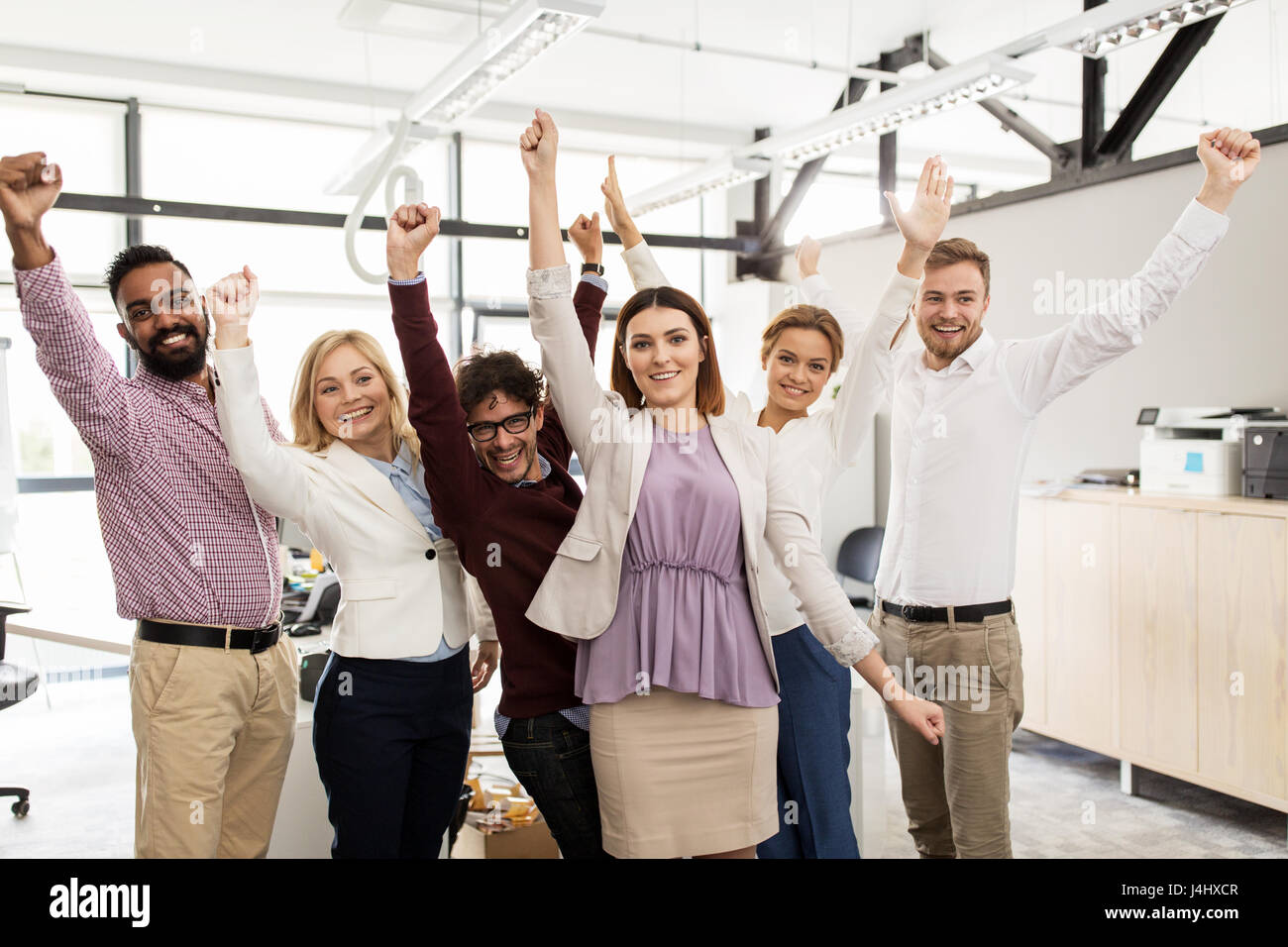 happy business team celebrating victory at office Stock Photo - Alamy