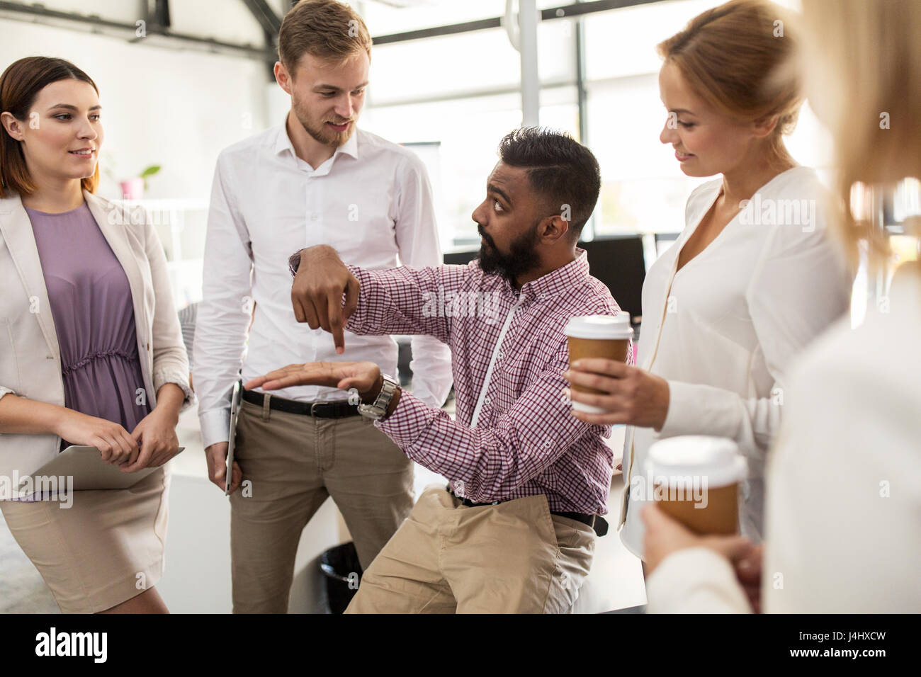 happy business team drinking coffee at office Stock Photo - Alamy