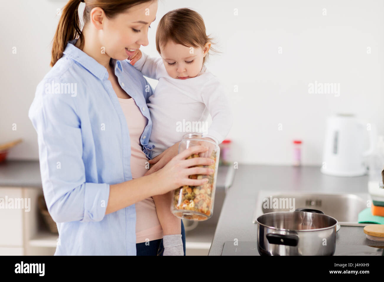 mother and baby cooking pasta at home kitchen Stock Photo - Alamy