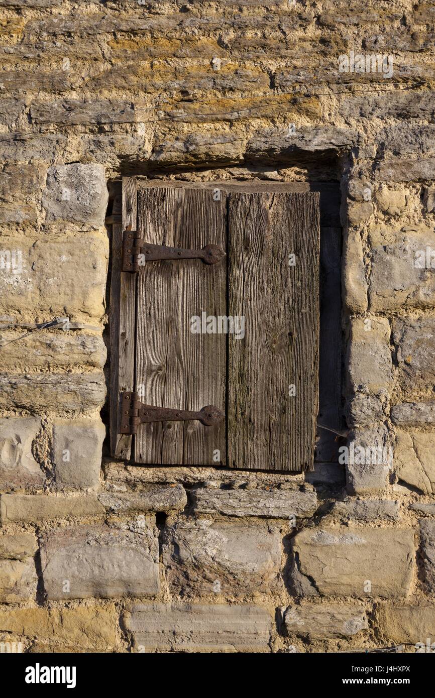 English stone barn with old wooden doors Stock Photo - Alamy