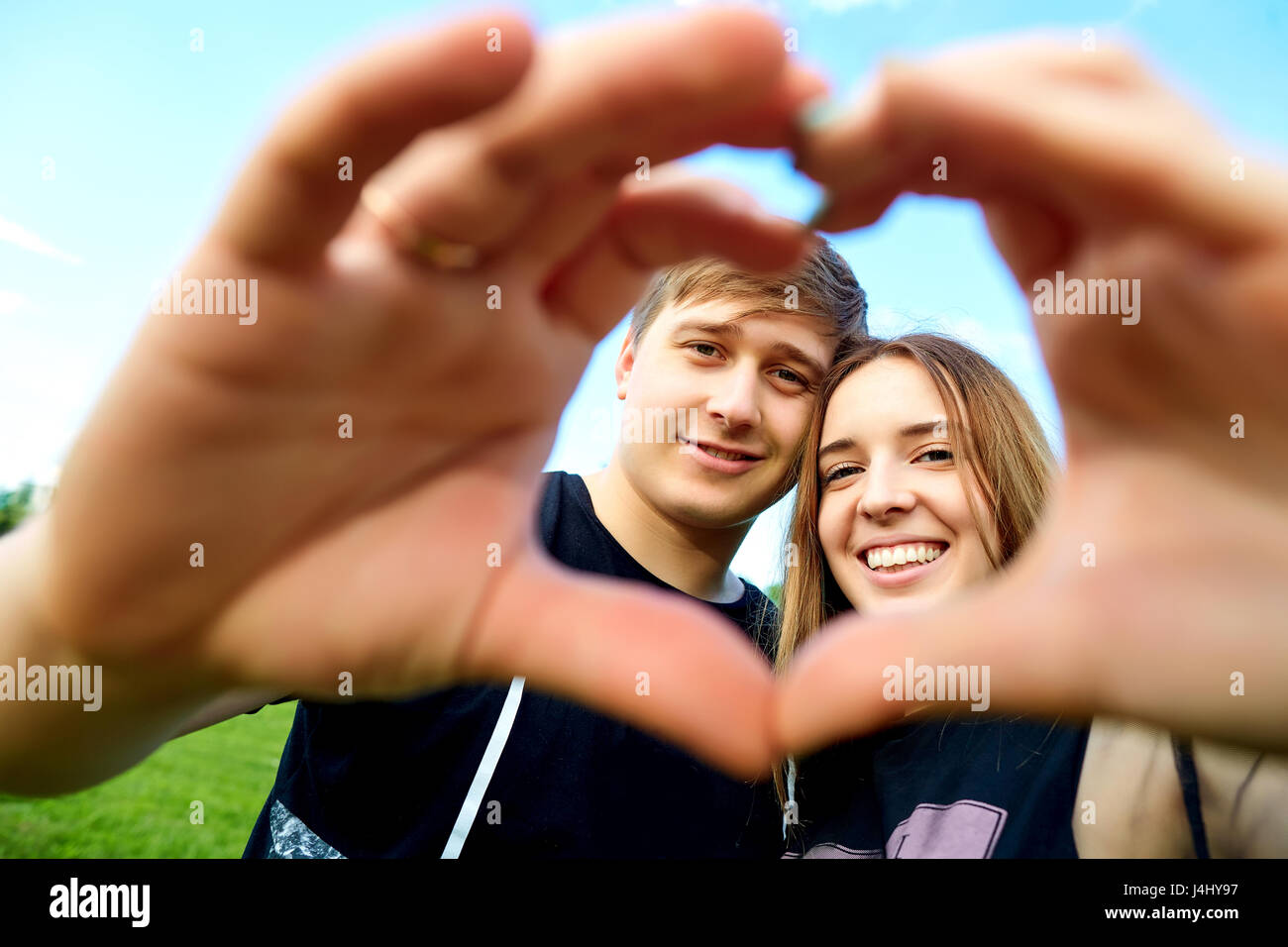 Couple making heart sign with hands hi-res stock photography and images ...