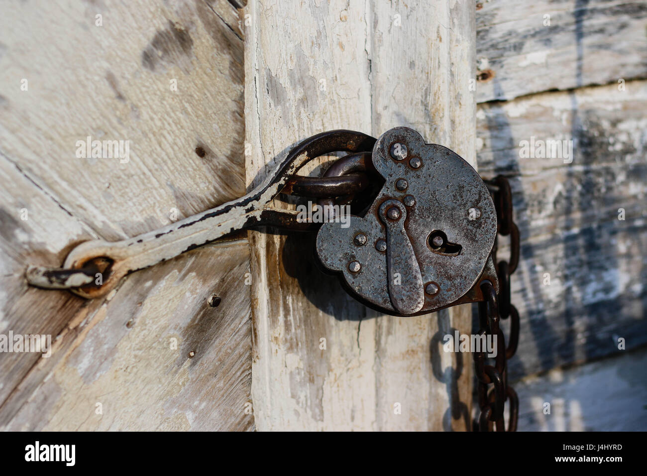 Vintage Padlock on Aged White Washed Wood Door Stock Photo - Alamy