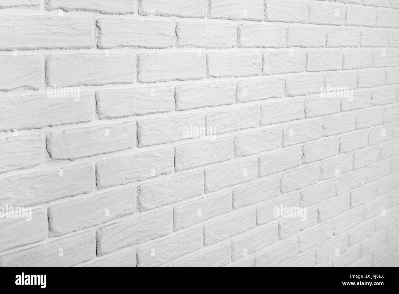 white brick wall, angle view, abstract background photo Stock Photo - Alamy