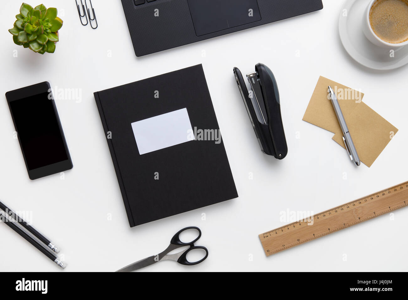 Office Supplies And Devices Arranged On White Desk Stock Photo - Alamy
