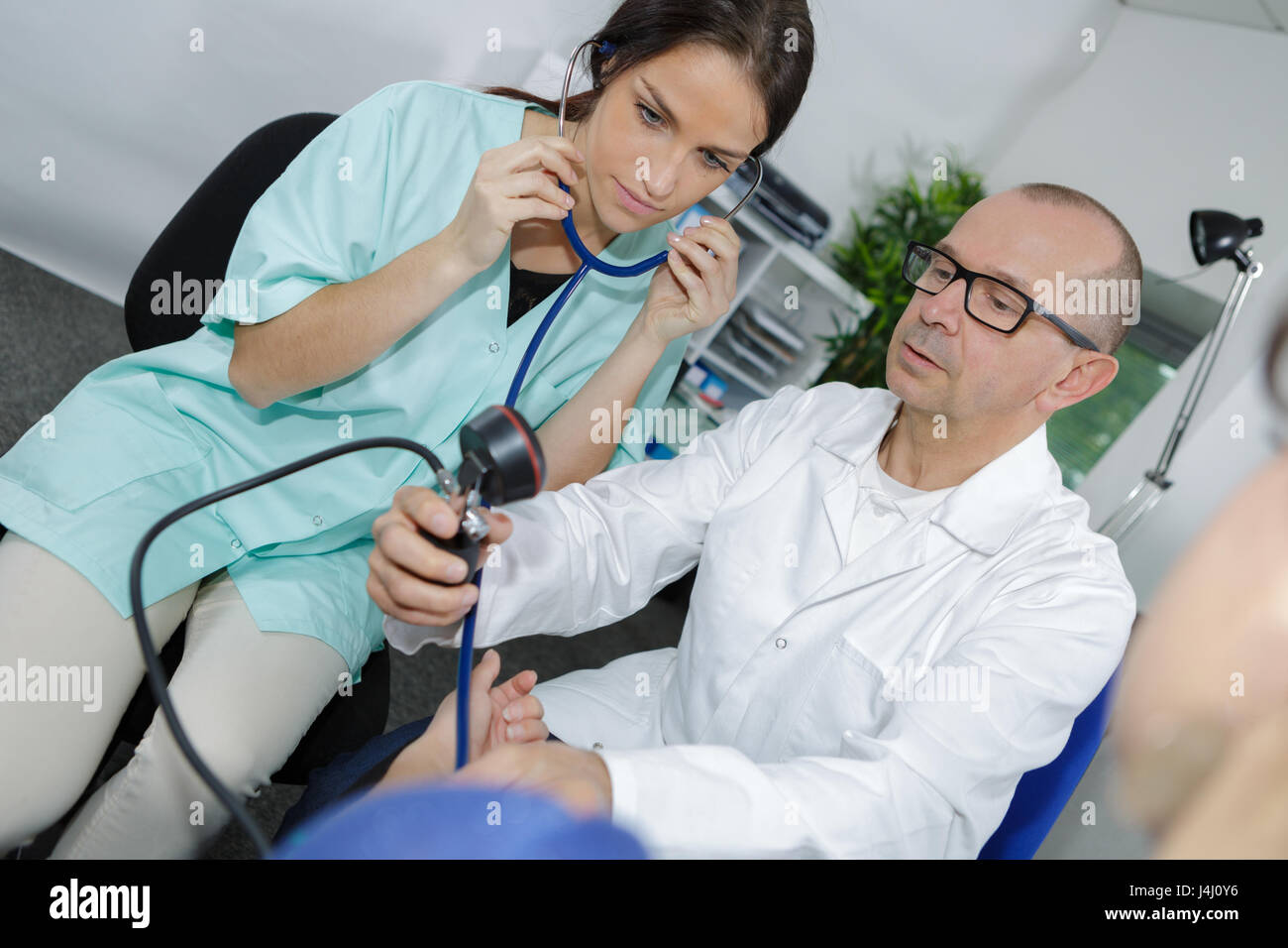 Nursing student using stethoscope Stock Photo - Alamy