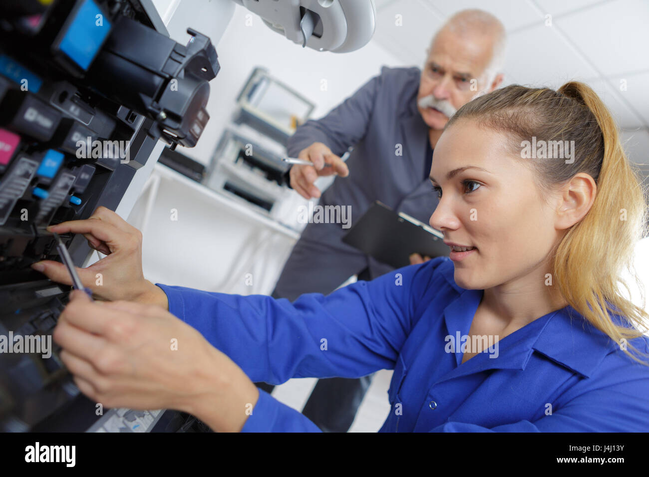 Female electrical engineer working on hi-res stock photography and ...