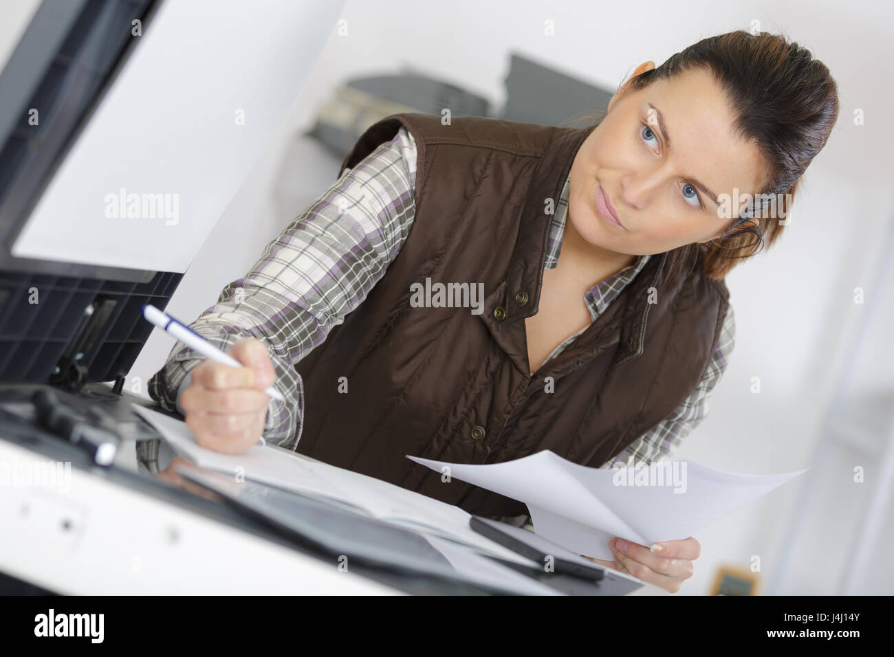 Lady thinking holding document hi-res stock photography and images - Alamy