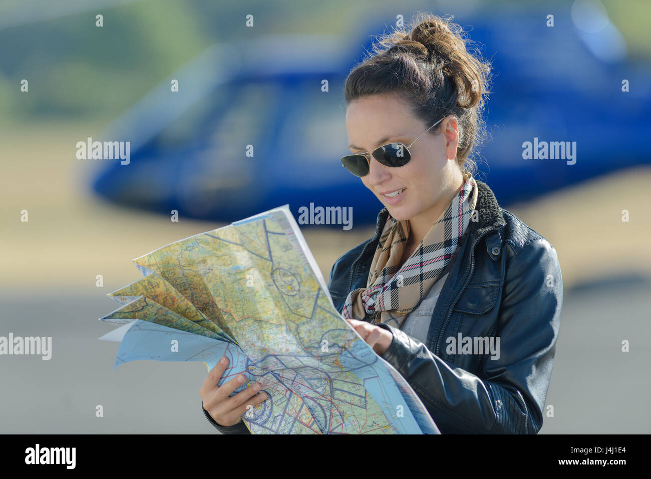 woman pilot checking a map Stock Photo - Alamy