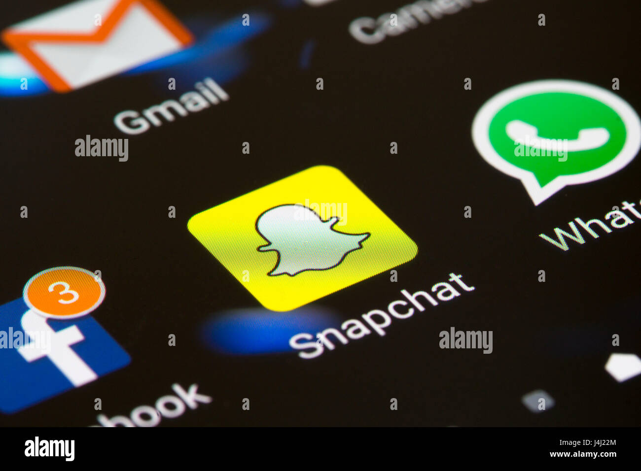 An closeup on the Snapchat icon on a smartphone screen Stock Photo - Alamy