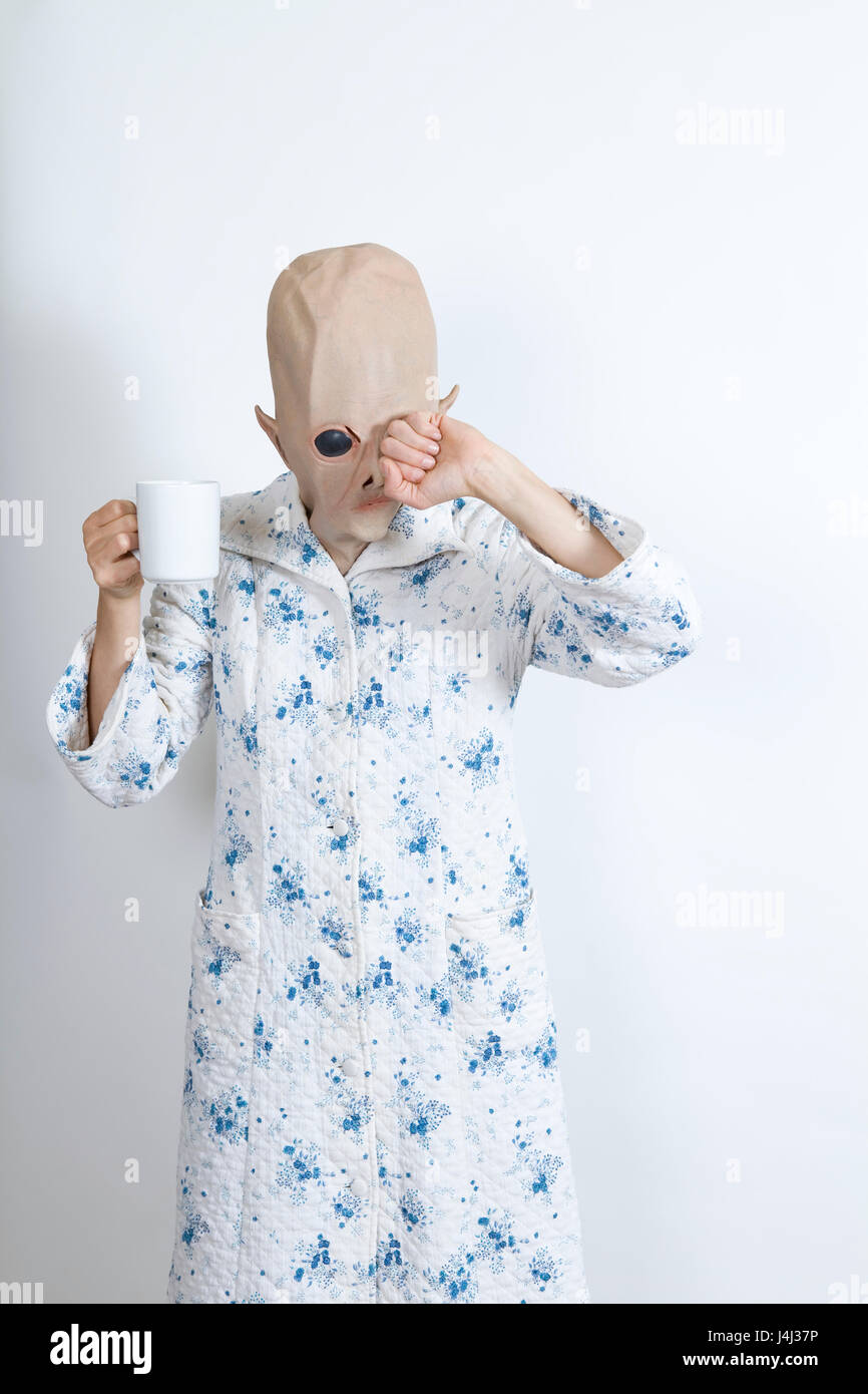 Alien difficult to wake in the morning Rubbing one's eyes and drinking ...