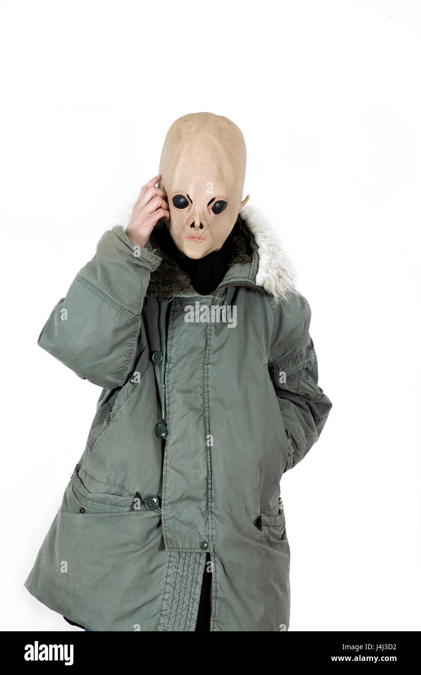 Alien wearing a military coat with hood fake fur Stock Photo - Alamy