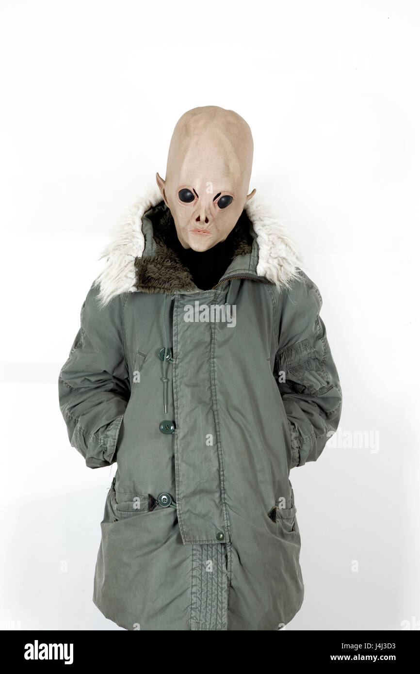 Alien wearing a military coat with hood fake fur Stock Photo - Alamy