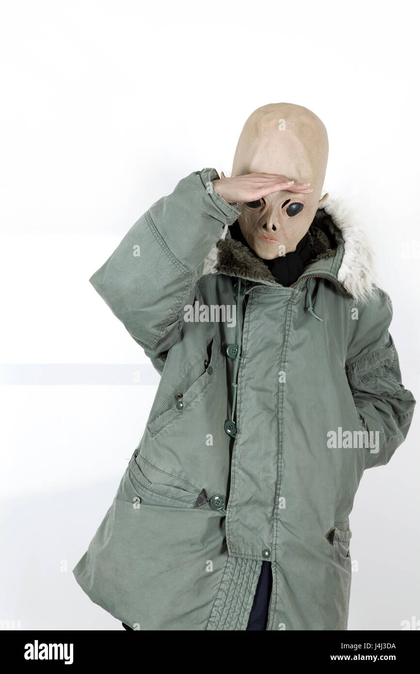 Alien wearing a military coat with hood fake fur Stock Photo - Alamy