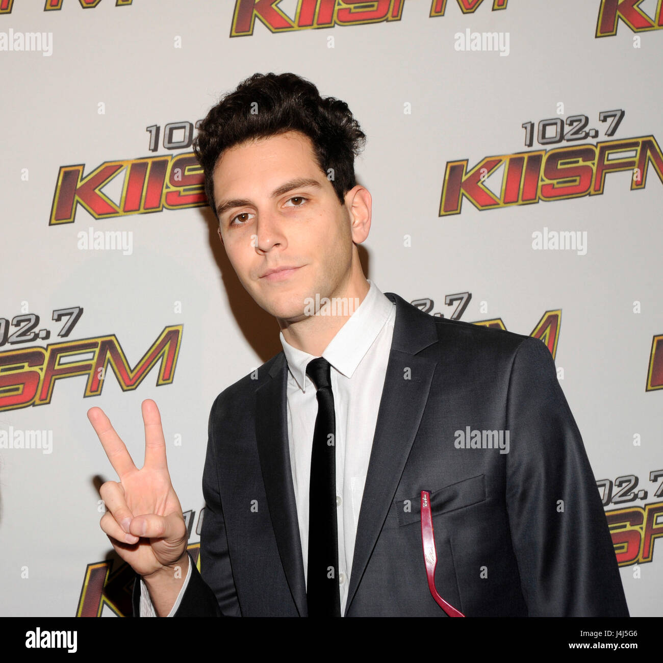 Gabe Saporta of Cobra Starship arrives throwing peace sign at the red ...
