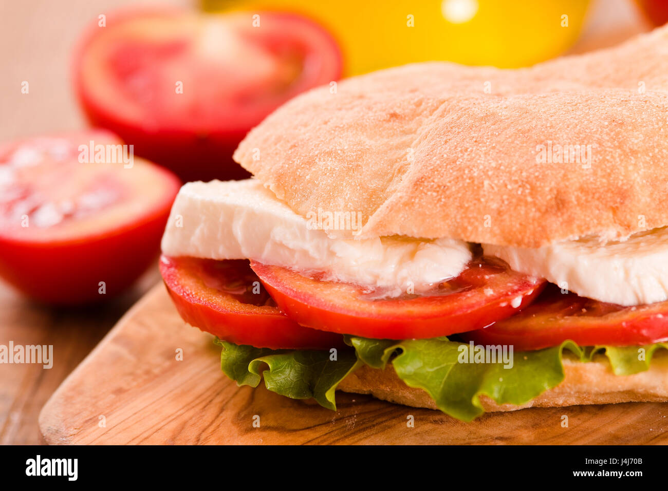 Puccia bread with mozzarella and tomato Stock Photo - Alamy