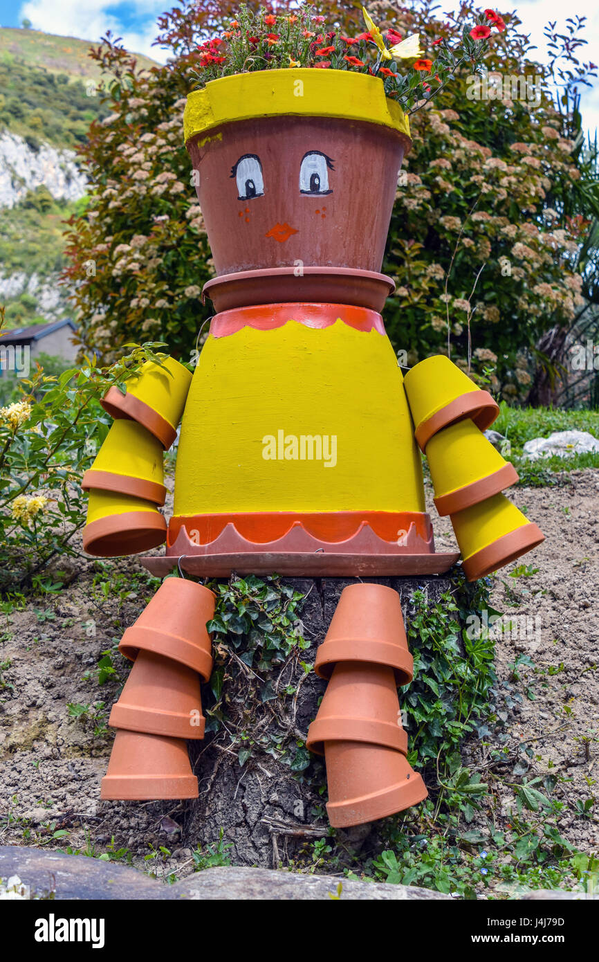 Garden figure made from different sized plant pots, Ariege, France ...