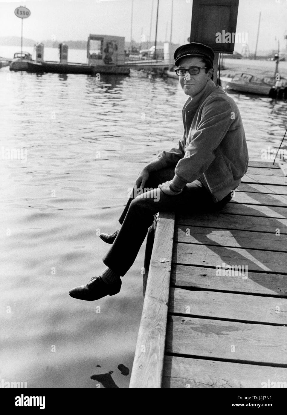 Peter Sellers British actor sits on a dock in Waxholm Sweden 1969 Stock ...