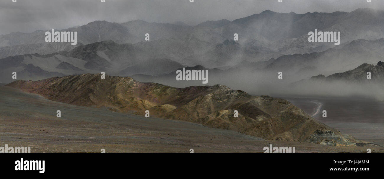 Dust storm in the Indus River valley: mountain ridge surrounds the ...