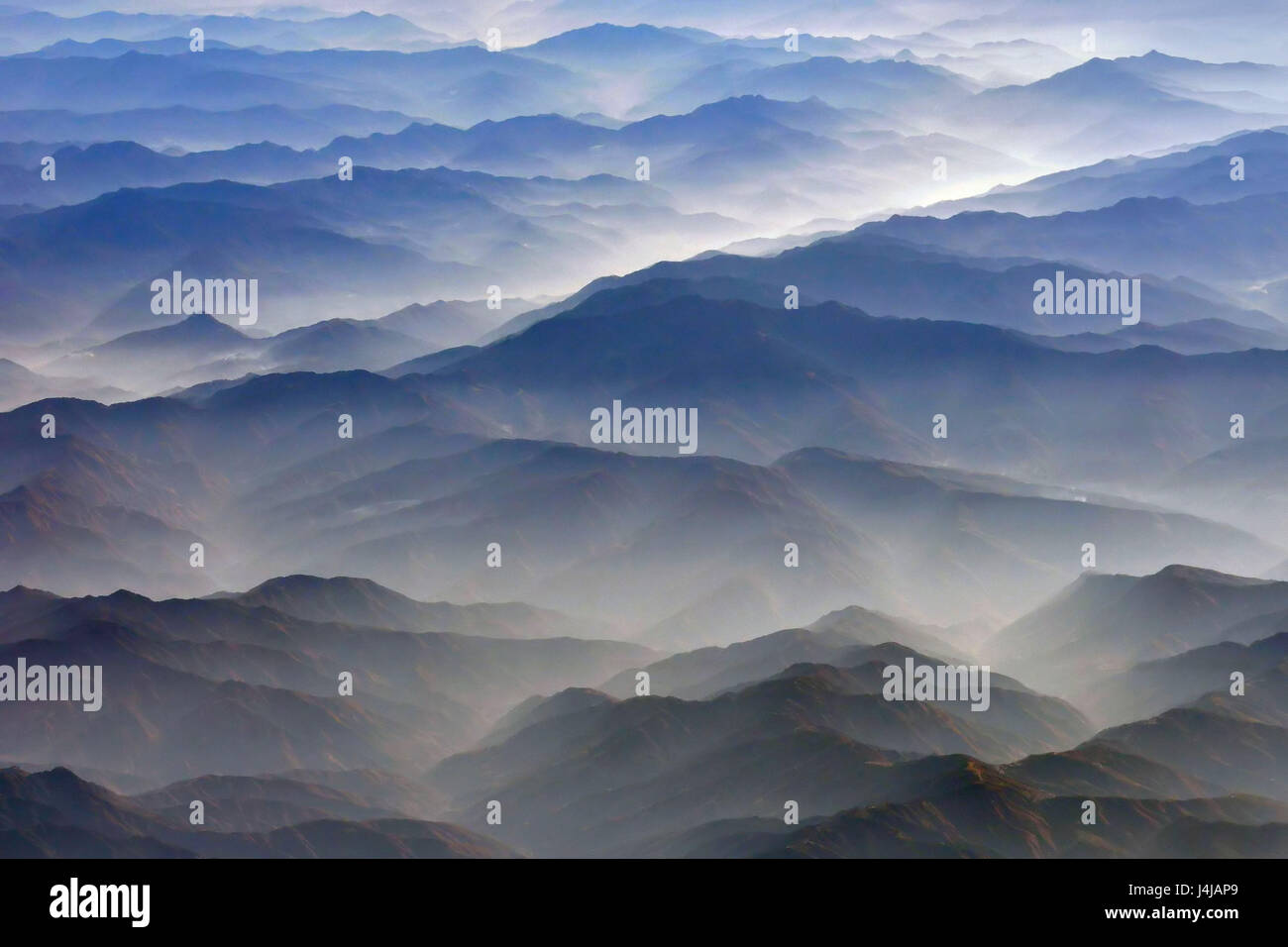 Bright contrasting silhouettes of mountain chains at sunrise ...