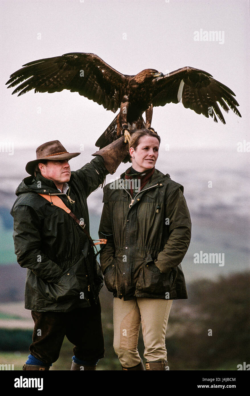 Falconers Steve and Emma Ford posing with one of their fully grown ...