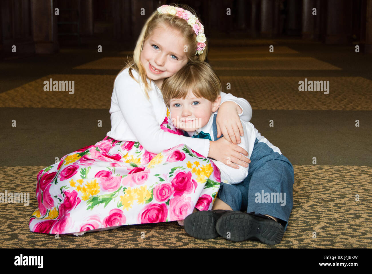 adorable brother and sister siblings hugging each other together ...