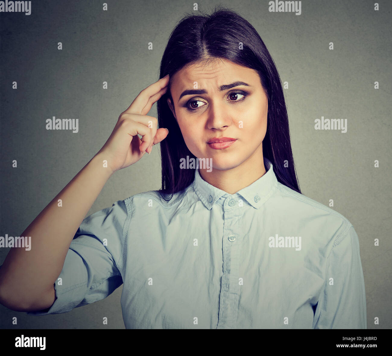 Worried pensive young woman thinking Stock Photo - Alamy Worried pensive young woman thinking Stock Photo - Alamy