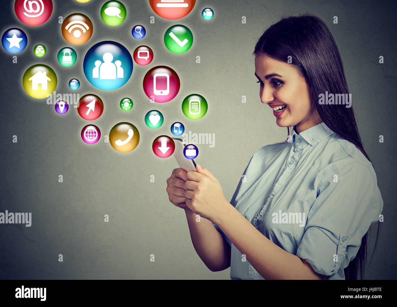Mobile communication technology concept. Happy young woman using ...