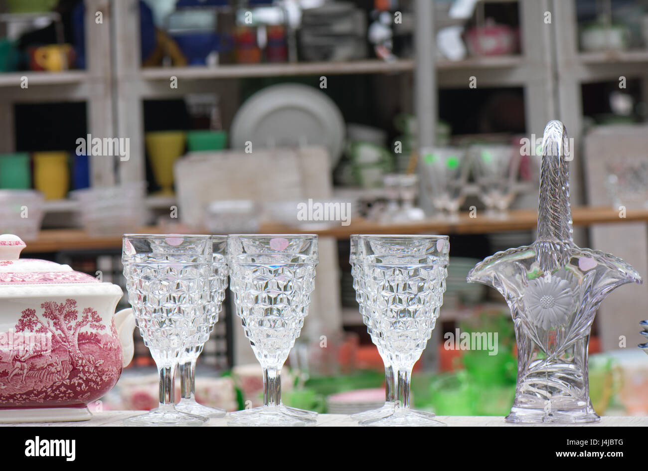 Translucent glassware at an outdoor antique shop Stock Photo - Alamy