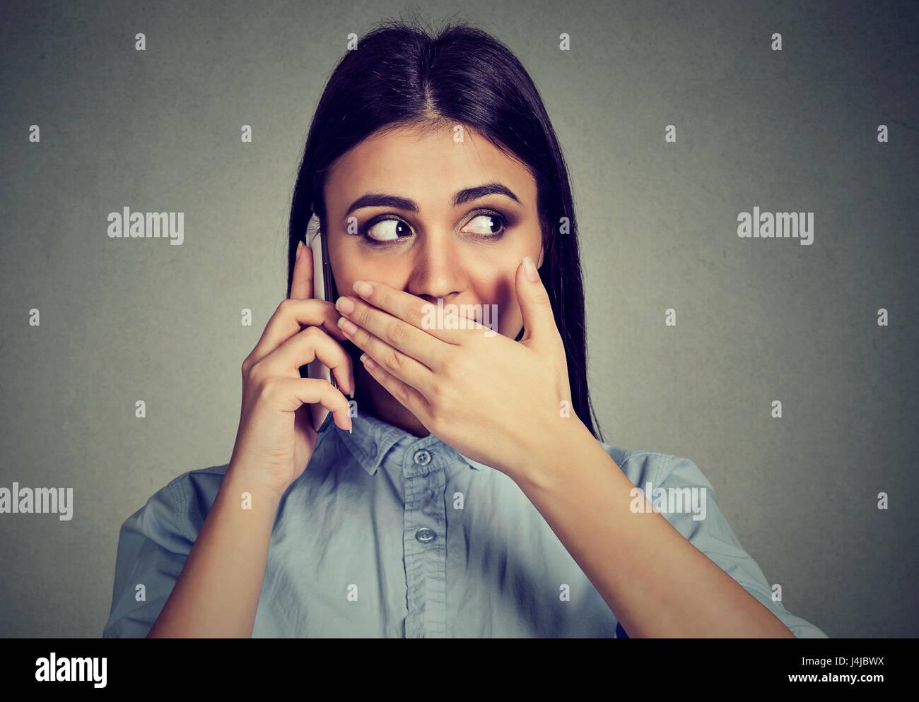 amazed shocked woman talking on mobile phone Stock Photo - Alamy