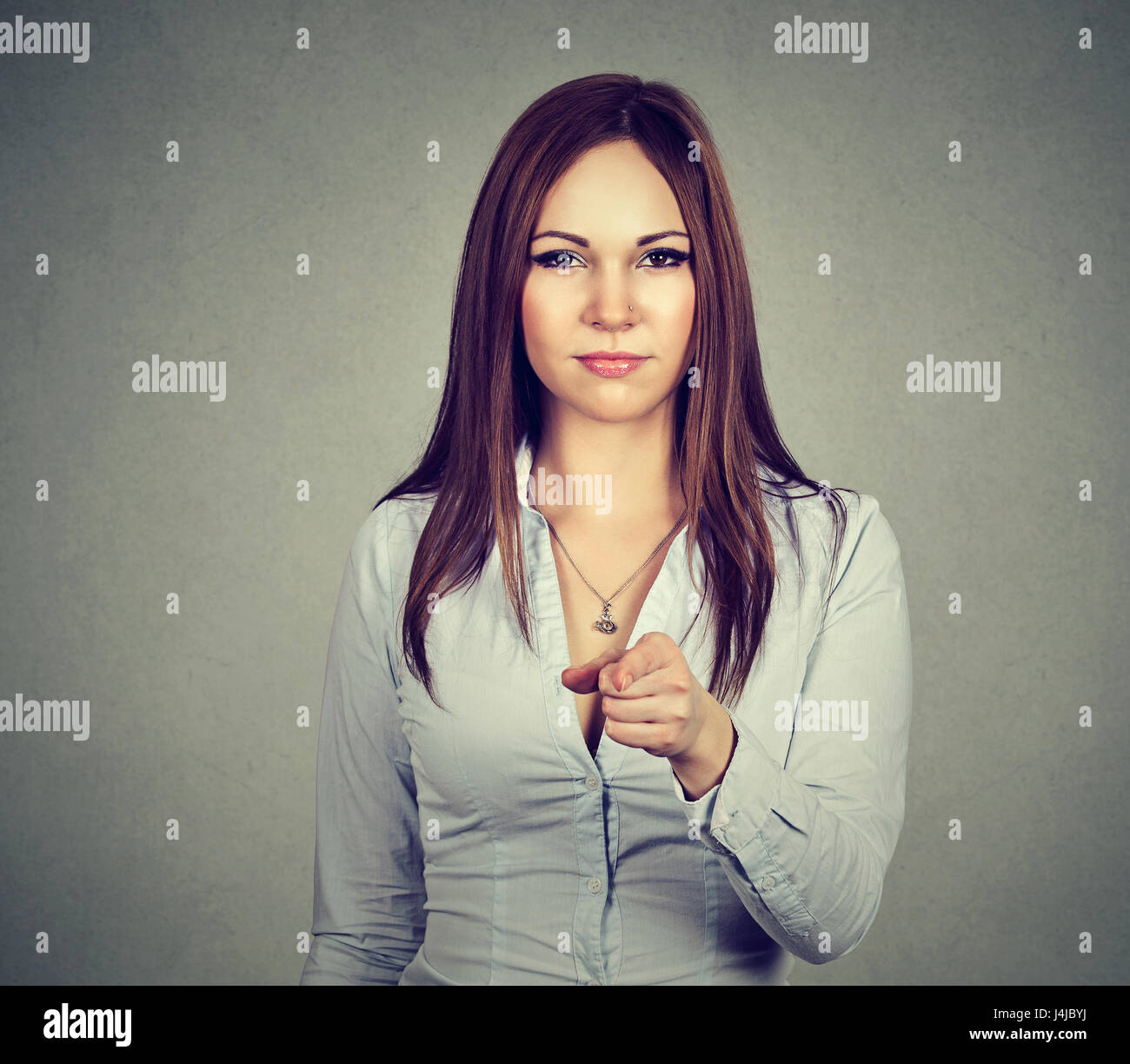 Serious woman pointing finger at you Stock Photo - Alamy