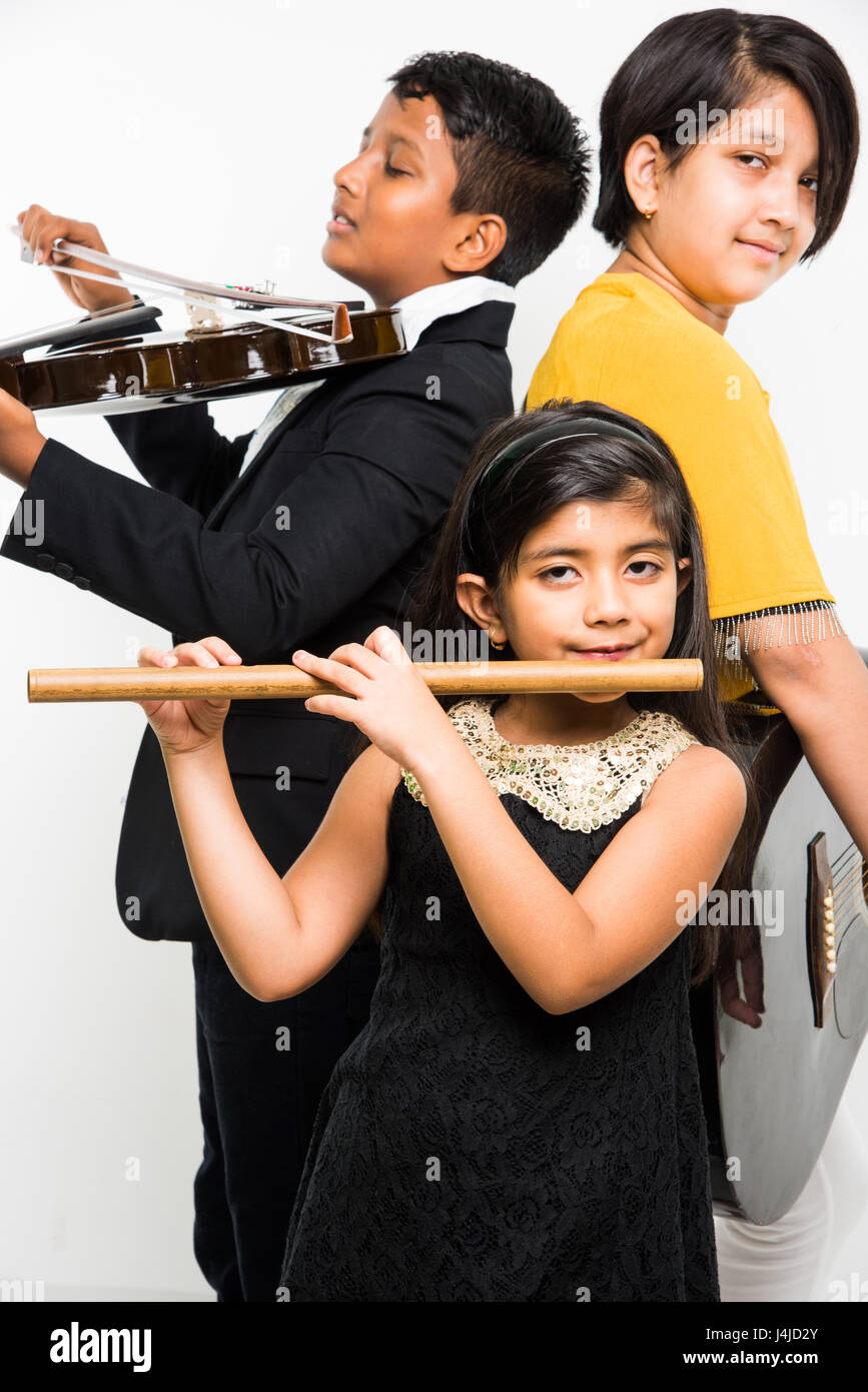 Kids and music concept - Cute little Indian kids playing musical ...