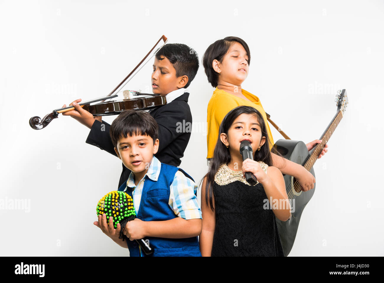 Kids and music concept - Cute little Indian kids playing musical ...